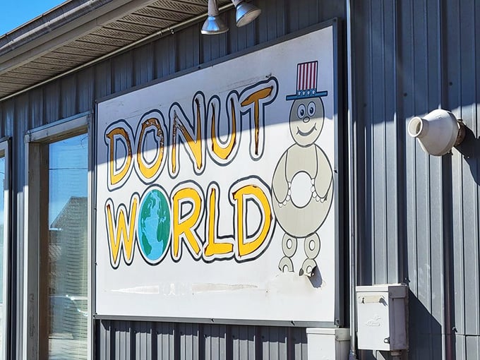 The cheerful Donut World mascot greets visitors with a smile that says, "Yes, donuts can indeed make your day better. Come on in!"