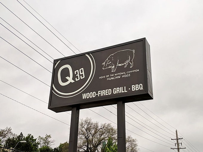 The roadside sign proudly announces "Home of the National Champion Munchin' Hogs" &ndash; a barbecue bat signal to serious meat enthusiasts everywhere.