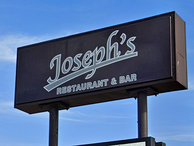 The sign that's guided hungry travelers for years, glowing against the Minnesota sky like a North Star for those seeking excellent whiskey steak.