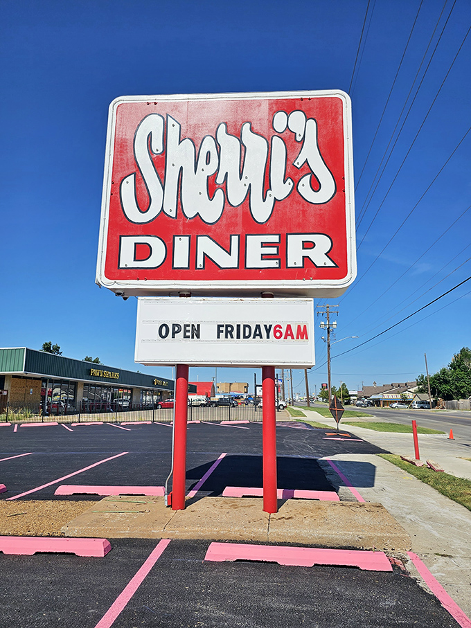 The classic red and white sign stands tall against Oklahoma's blue sky&mdash;a beacon for breakfast pilgrims seeking hash brown salvation.