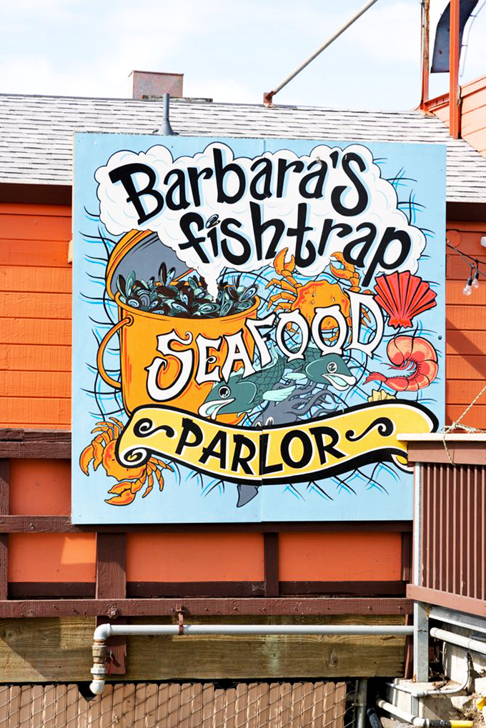 The whimsical sign promises seafood adventures within&mdash;like a storybook cover that hints at the delicious tales waiting to be told inside.