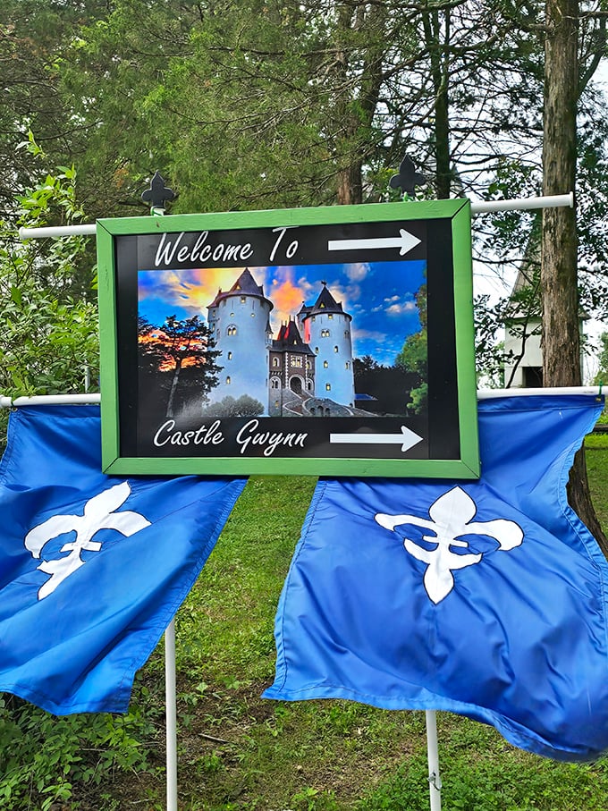 "This way to time travel!" The welcoming sign and fleur-de-lis flags guide modern-day adventurers to their medieval destination.