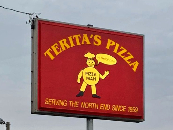 The roadside beacon that's guided hungry travelers for generations. That cheerful pizza man has become a North End Columbus landmark.