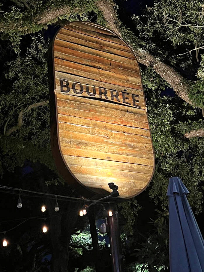 At night, the illuminated wooden sign serves as a beacon for flavor-seekers. Like a lighthouse guiding hungry ships to delicious shores.