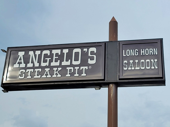The illuminated sign stands as a beacon for beef lovers, promising both steaks and saloon revelry under one roof.