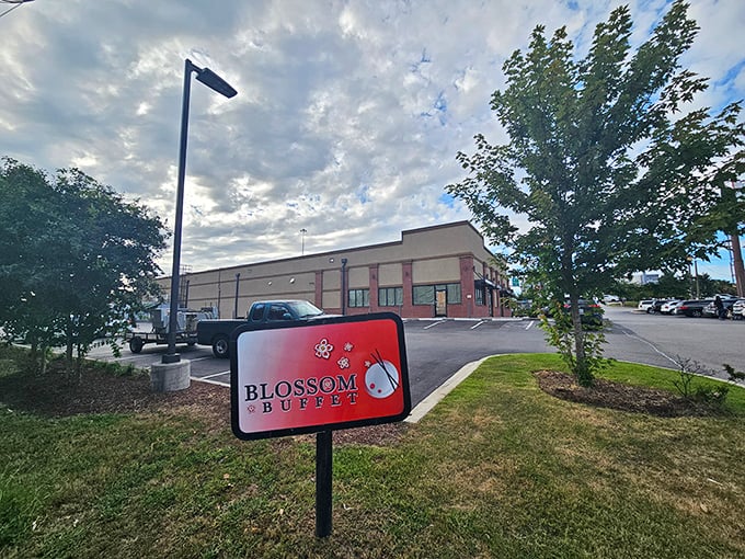The roadside sign stands like a friendly sentinel, beckoning hungry travelers with the simple promise of abundance inside.