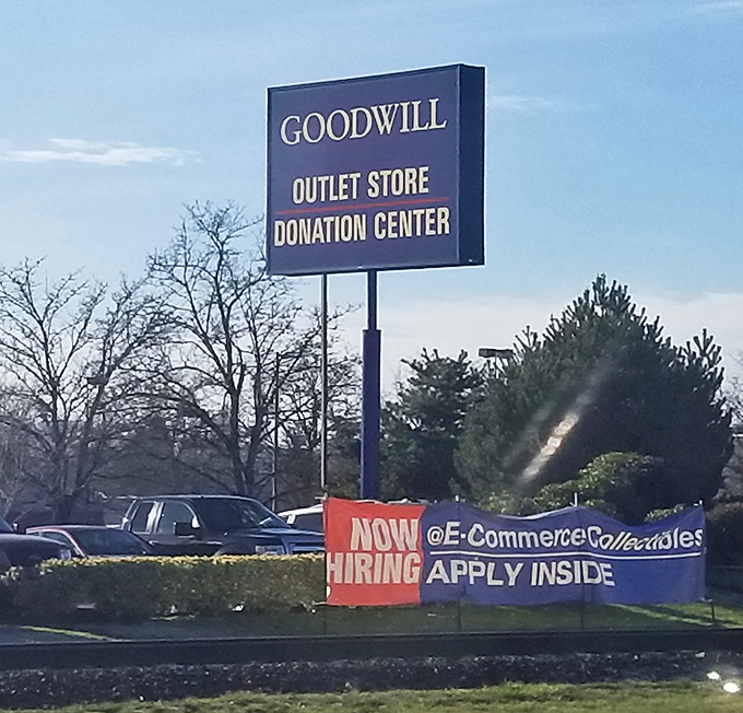 The siren call of secondhand salvation. This sign doesn't just advertise a store&mdash;it announces an adventure where $27 fills a cart.