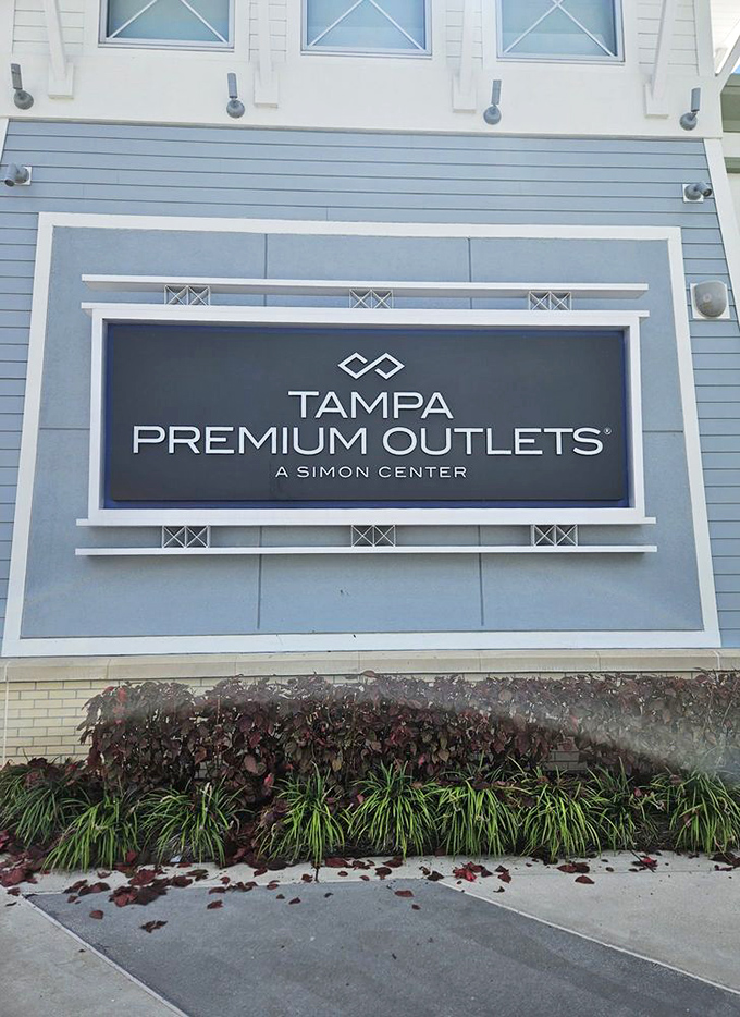 The official signage welcomes bargain hunters to their happy place, where deals flow like Florida's legendary afternoon rain.