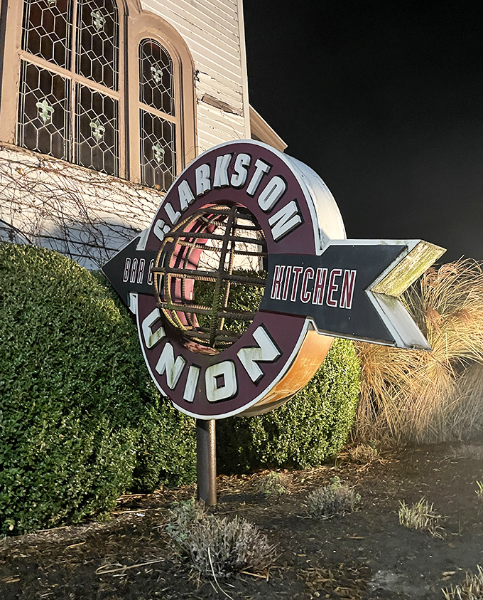 The sign that's guided hungry travelers like a culinary North Star. Glowing against the night sky, it whispers, "You've arrived."
