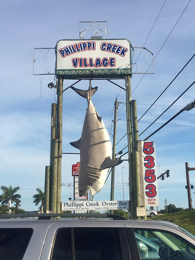 You can't miss this landmark! The iconic shark sign at Phillippi Creek Village stands as a beacon for seafood lovers searching for their next great meal.