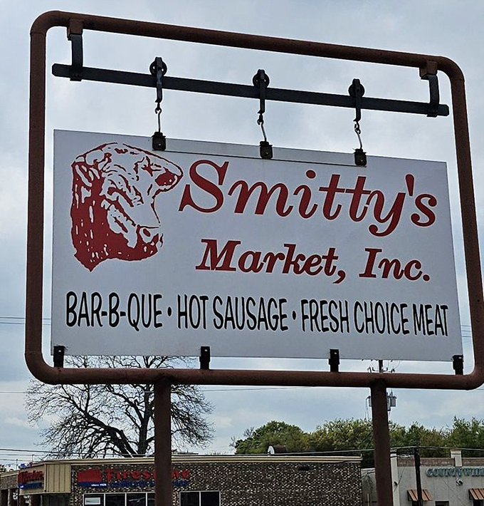The sign says it all: "BAR-B-QUE &bull; HOT SAUSAGE &bull; FRESH CHOICE MEAT." No false advertising here&mdash;just the honest promise of smoky satisfaction.