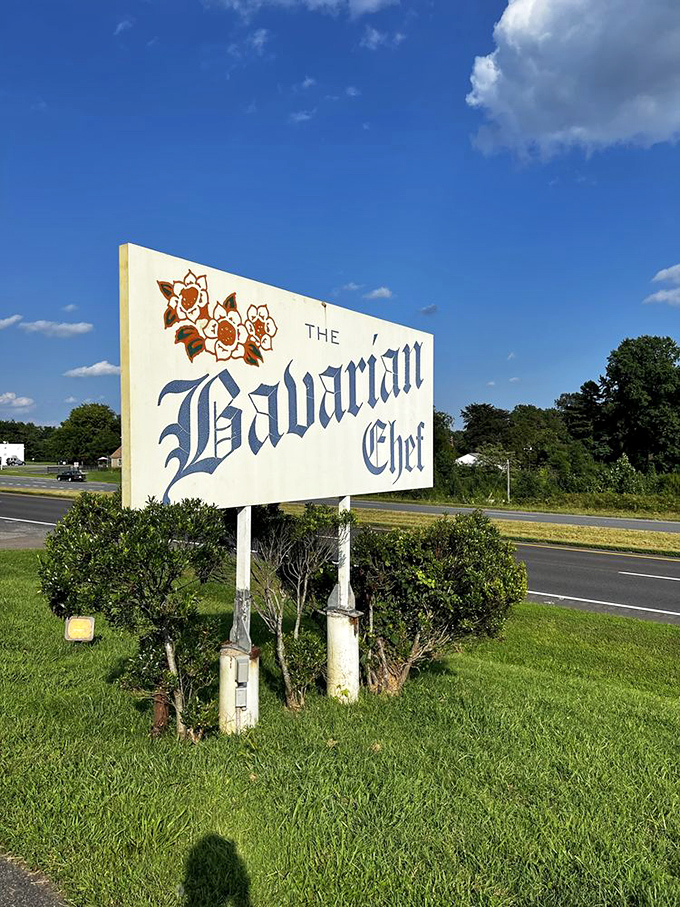 The roadside sign stands as a beacon of hope for hungry travelers, promising old-world delights just beyond the Virginia pines.