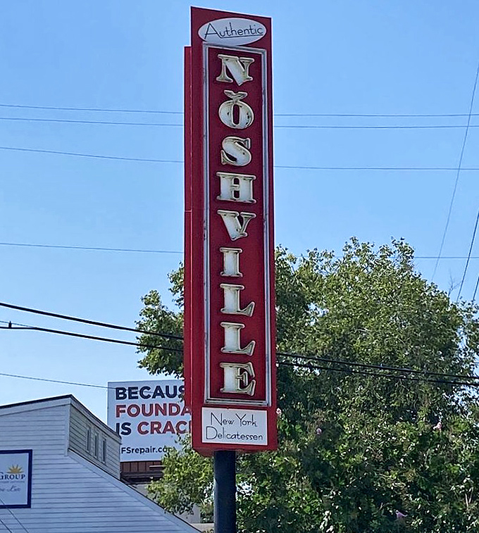 This sign stands tall like a delicious promise. It's not just pointing to a restaurant&mdash;it's directing you toward your next great meal.