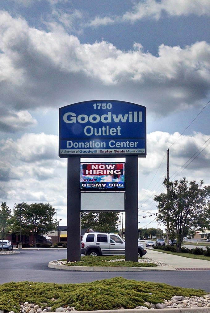 The beacon of bargains stands tall on Woodman Drive. This sign has guided countless treasure hunters to their quarry.