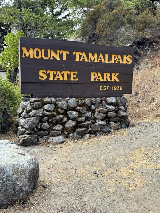 The entrance sign promises adventure beyond&mdash;like the cover of a book you already know contains the most wonderful story.