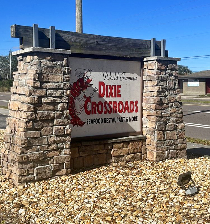 The stone entrance sign stands like a culinary lighthouse, promising "World Famous" seafood that actually lives up to the billing.