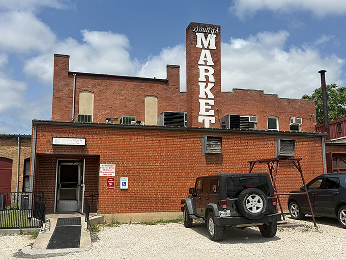 Smitty's Market's unassuming exterior hides a temple of Texas barbecue where smoke-stained walls tell you everything you need to know about what's inside.