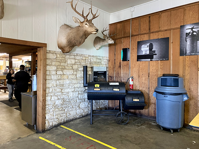 Where the magic happens &ndash; a smoker that's witnessed more barbecue history than most of us will ever know, flanked by deer mounts and limestone walls.