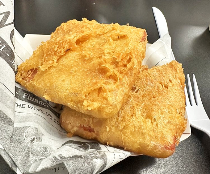 Spam fritters&mdash;World War II nostalgia transformed into crispy, savory indulgence. These golden packages prove that sometimes the most humble ingredients make the most satisfying bites.