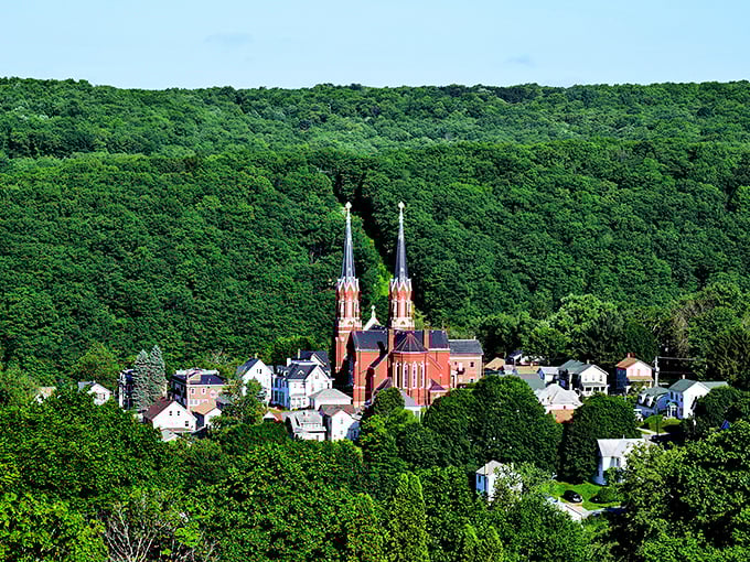 Twin spires of St. Joseph Church pierce the green canopy, creating a fairytale silhouette that would make European villages jealous of this Pennsylvania gem.