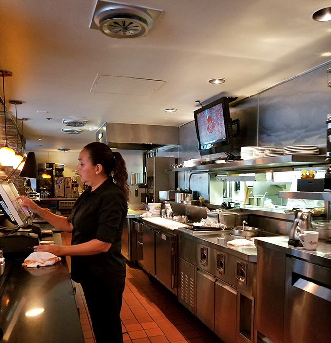 The staff moves with the practiced efficiency of people who know your order before you do. Breakfast virtuosos at work.