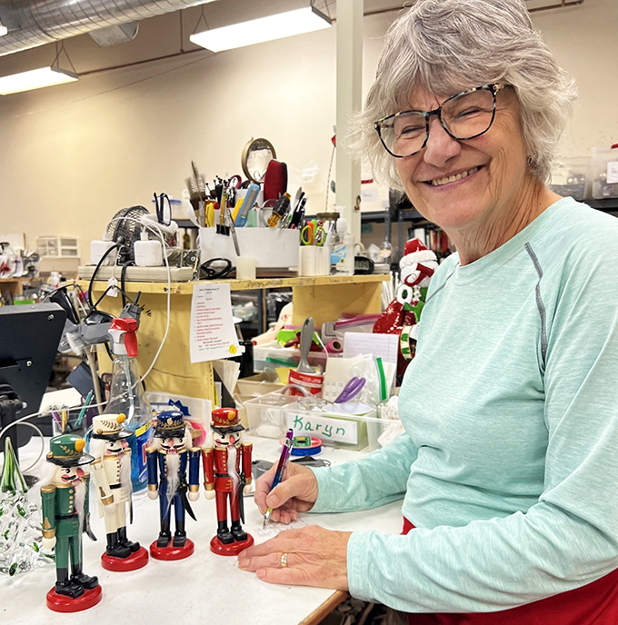 Smiling staff members spread joy while organizing donations that will become someone else's perfect discovery.
