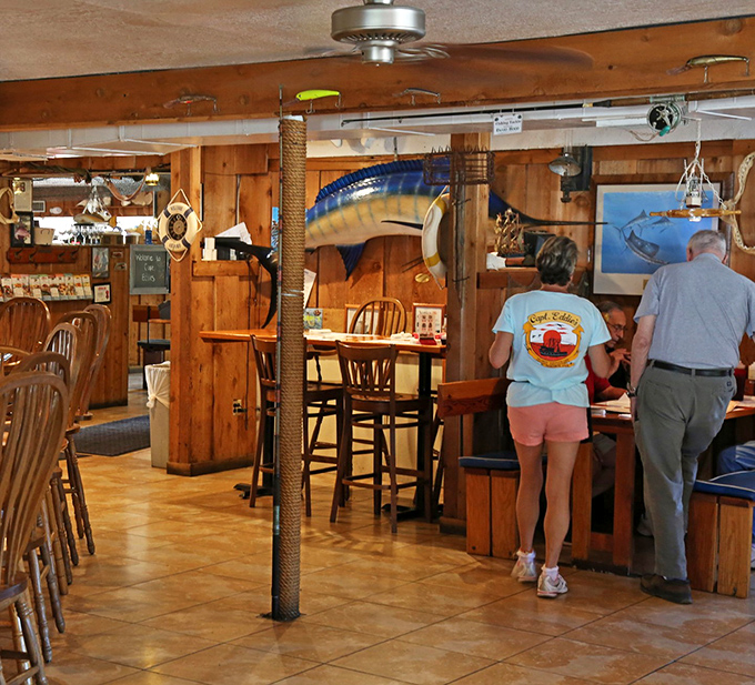 Wood-paneled walls adorned with oceanic treasures create the perfect backdrop for seafood that tastes like it just left the water.