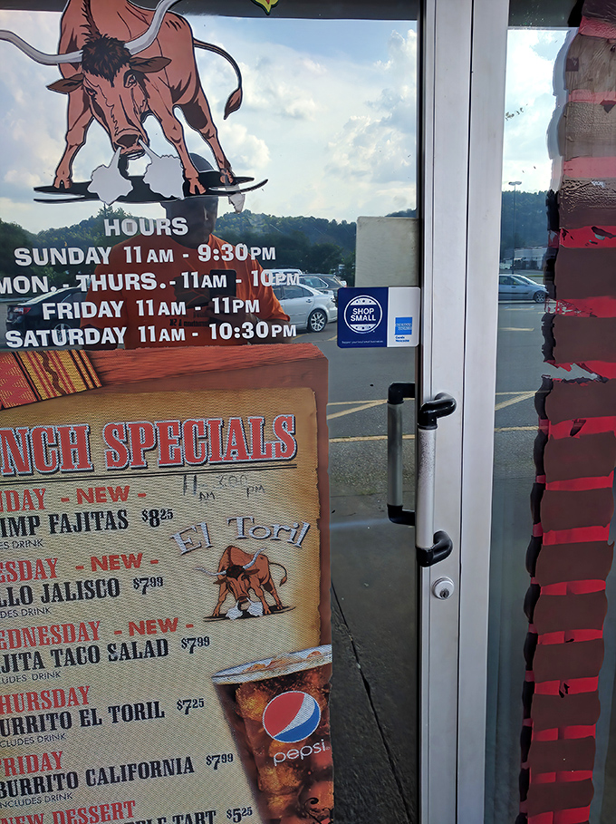 The iconic bull logo watches over the restaurant hours like a tasty timekeeper. Even bulls know when it's time for lunch specials.