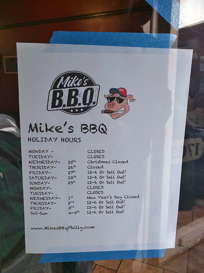 The holiday hours sign featuring their sunglasses-wearing pig logo &ndash; a friendly reminder that even barbecue heroes need occasional rest.