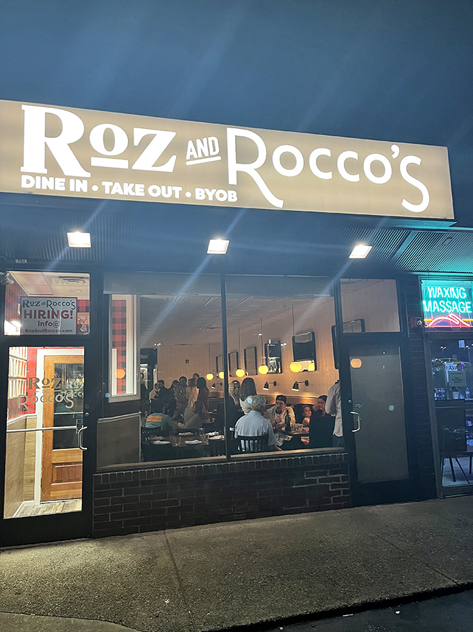 As night falls, the restaurant glows like a beacon for hungry travelers. The illuminated sign promises comfort and satisfaction to all who enter.