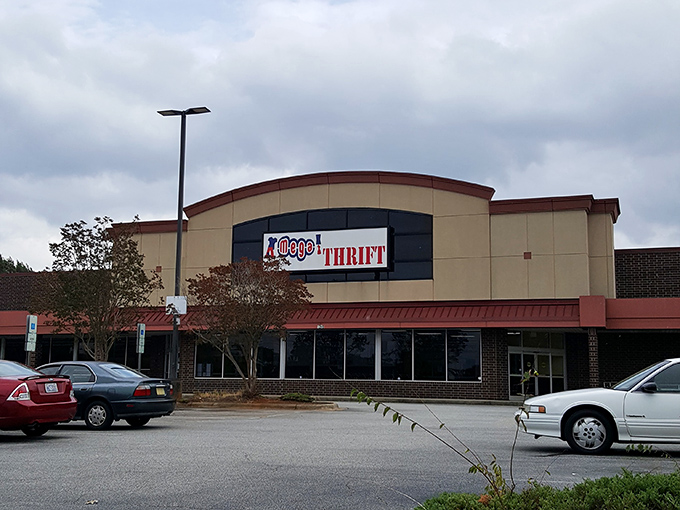 The exterior view on a cloudy day reveals Mega Thrift in all its glory&mdash;a cathedral of consignment commanding its corner of Winston-Salem.