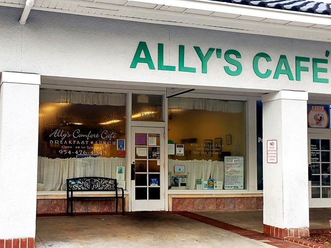 The green Ally's Cafe sign&mdash;a beacon of hope for hungry travelers and a landmark for locals who know where real Florida flavor lives.