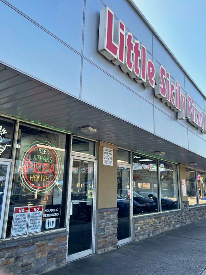 The neon sign promises three essential food groups: beer, steaks, pizza, and hoagies. Math was never my strong suit, but the food arithmetic checks out.