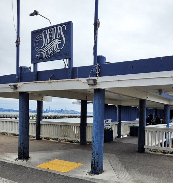 The iconic blue sign stands as a beacon for hungry travelers, promising seafood salvation just steps from the Berkeley Marina.