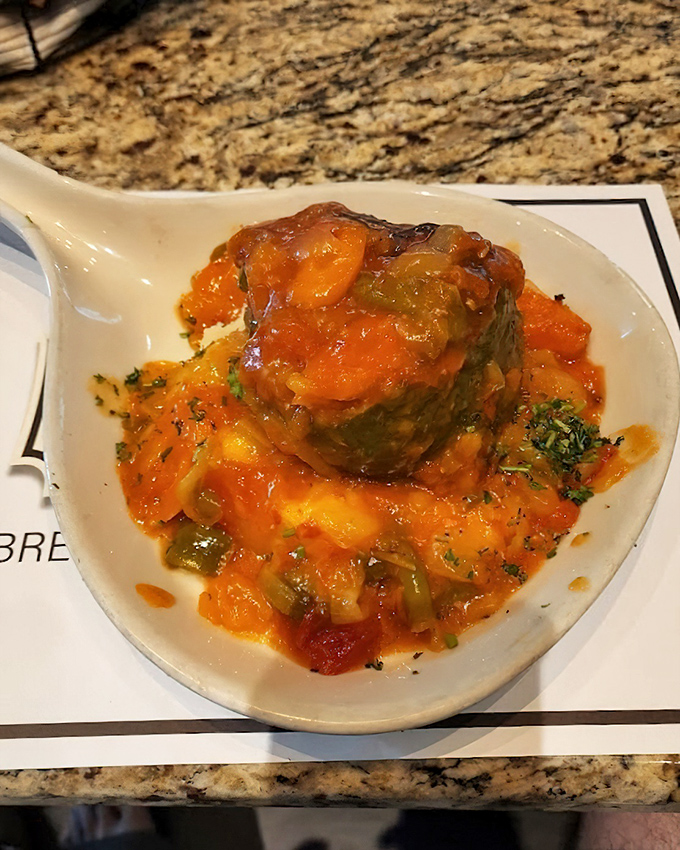 This stuffed pepper isn't just dinner—it's a colorful flavor grenade waiting to detonate a tomato-based explosion of Mediterranean comfort on your taste buds.