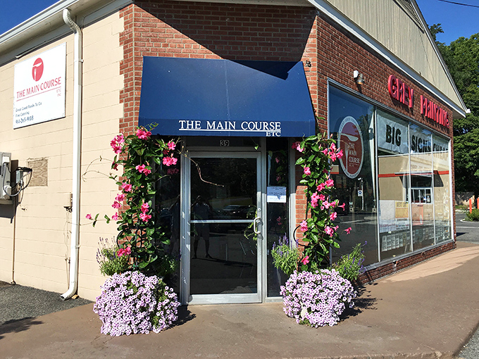 The Main Course welcomes you with flowers so vibrant they make the food jealous. Small-town hospitality in full bloom.