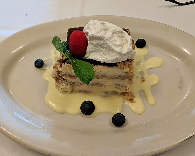 The tiramisu arrives like the perfect encore—light, sophisticated, and leaving you plotting your return before the last bite disappears.