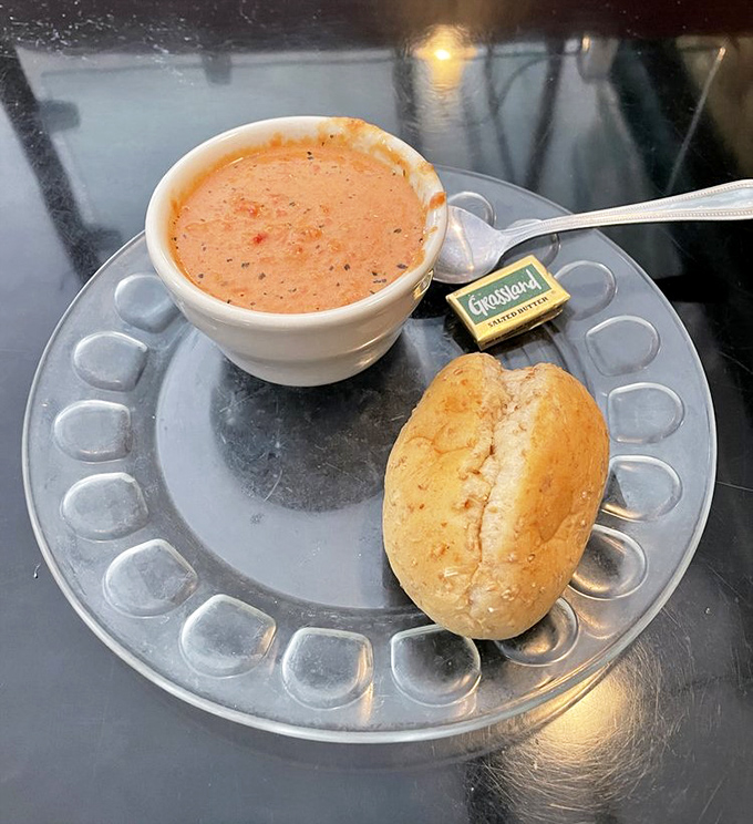Tomato bisque that understands comfort doesn't need to be complicated&mdash;just perfectly seasoned, soul-warming, and ready for that roll to take a dip.