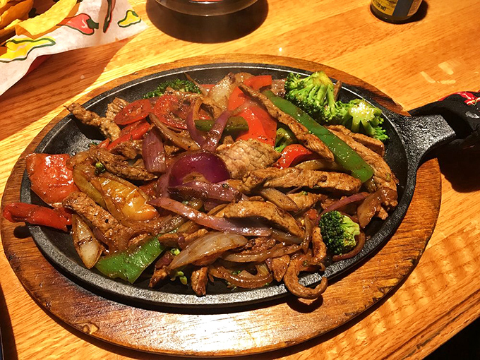Sizzling fajitas that announce their arrival before you see them. The cast iron skillet isn't just cooking&mdash;it's performing a one-pan show.