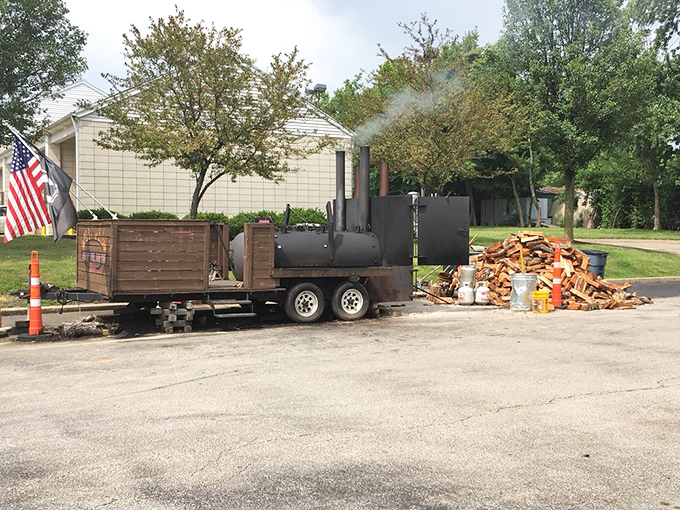 The source of all that smoky magic: a serious trailer-mounted smoker. This isn't equipment; it's a time machine that transforms raw meat into edible memories.
