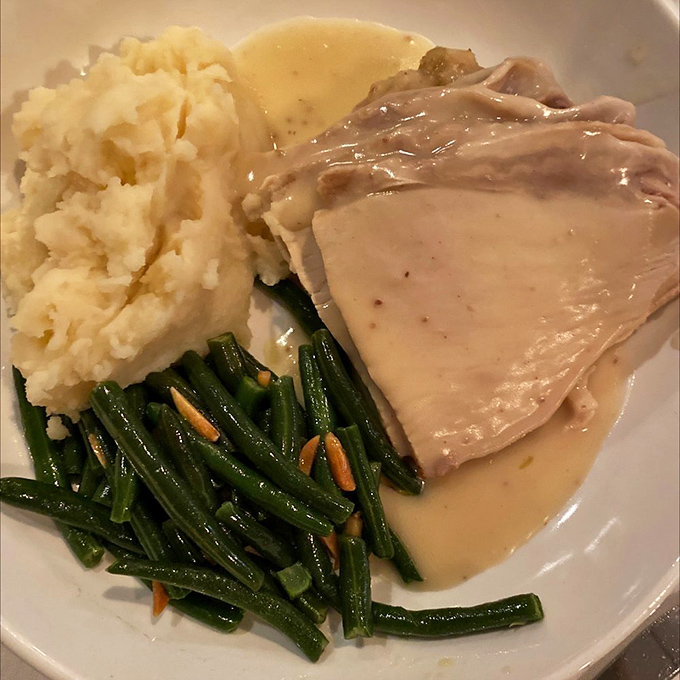 Comfort on a plate: tender turkey, cloud-like mashed potatoes, and green beans that actually make you want to eat your vegetables.