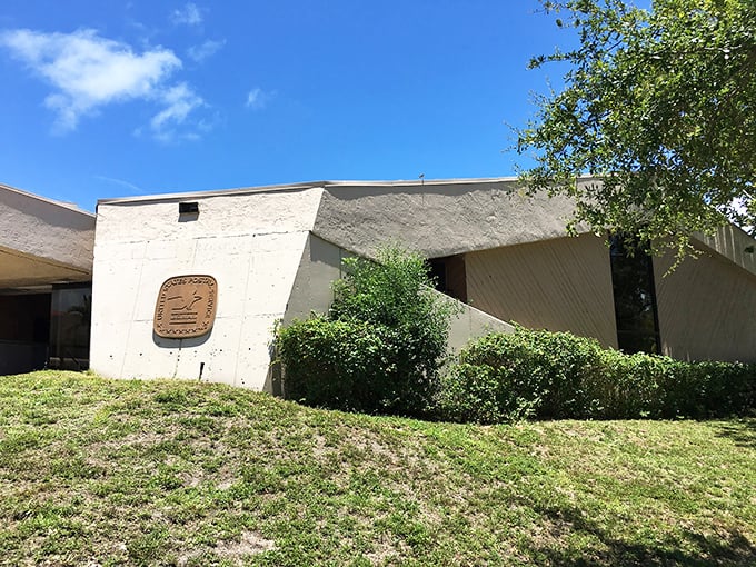 Modern architecture meets Florida sunshine at the local post office, where even sending bills feels somehow more pleasant with palm trees nearby.