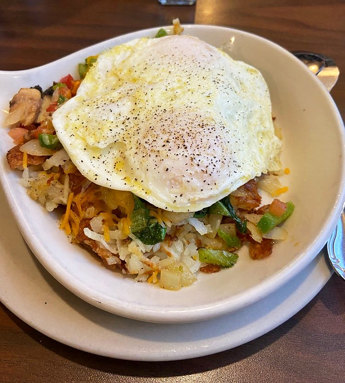 A veggie skillet topped with a perfect sunny-side-up egg&mdash;proof that vegetables can party just as hard as bacon when given the right dance floor.