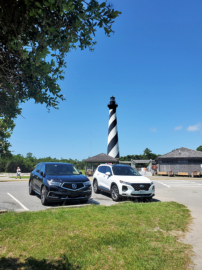 From the parking lot, visitors get their first glimpse of the towering landmark that has guided ships safely past the "Graveyard of the Atlantic" for generations.