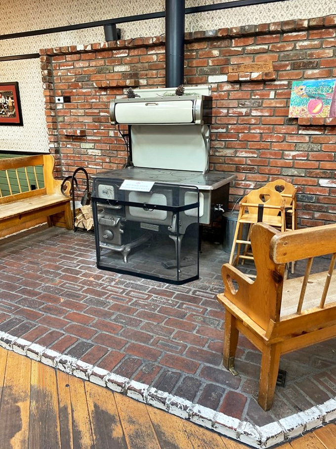 The vintage stove stands like a museum piece against the brick wall &ndash; a nod to simpler times when patience produced perfection.