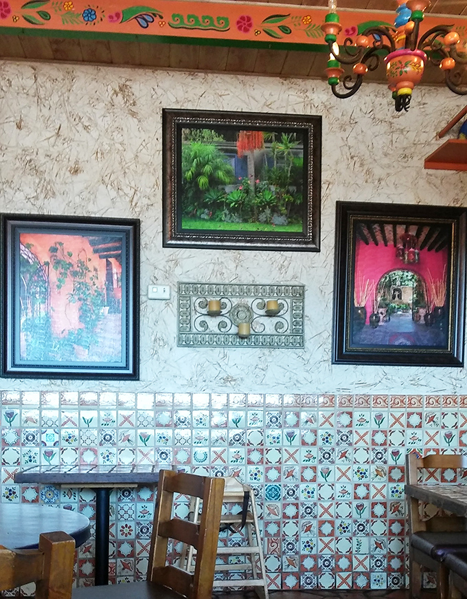 The wall art creates a gallery-like atmosphere, giving you something beautiful to admire while waiting for your beautiful plate to arrive.