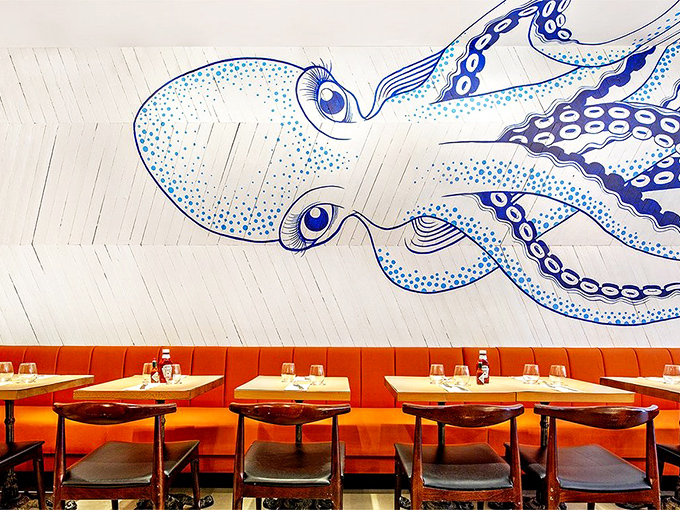The octopus mural isn't just decoration&mdash;it's practically a dining companion, its watchful eyes and flowing tentacles setting the perfect undersea mood.