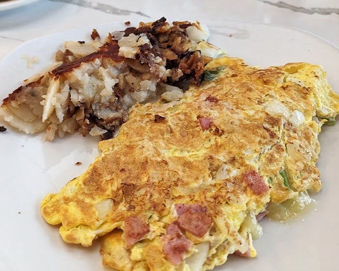 This Western omelet has rounded up all the right ingredients and corralled them into fluffy egg perfection. Those hash browns deserve their own zip code.