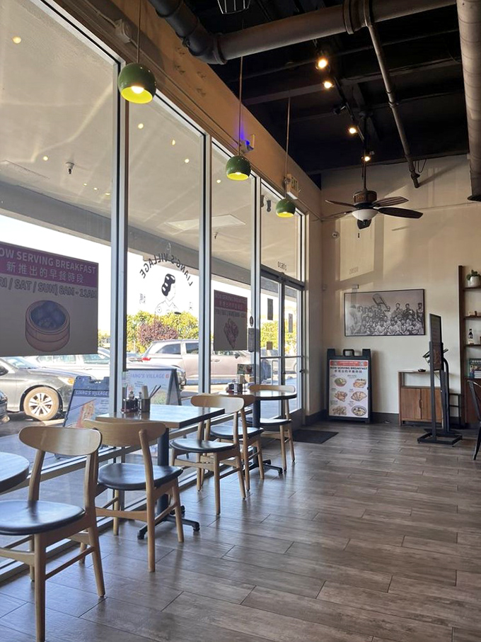 Sun streams through floor-to-ceiling windows, illuminating wooden tables where morning diners contemplate life's big questions over beef pancake wraps.
