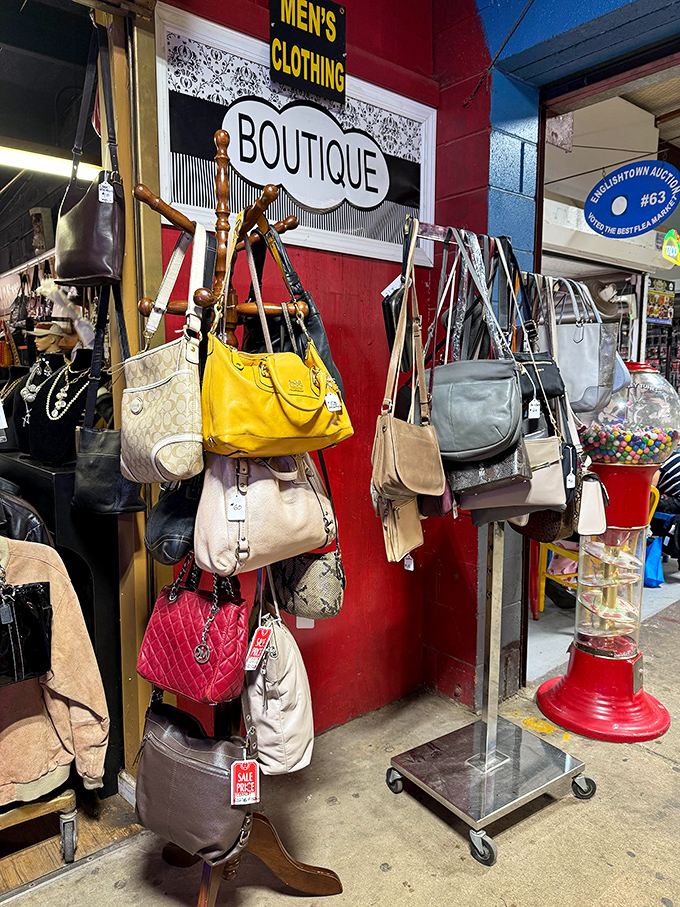 Designer dreams at flea market prices—these handbags hang like colorful fruit, ripe for the picking by fashion-savvy bargain hunters.